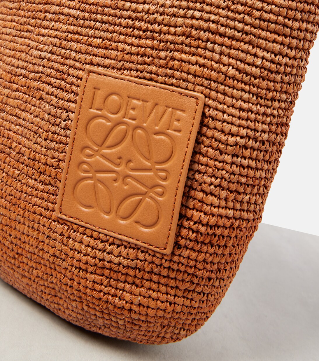 Slit Mini raffia tote bag in brown - Loewe | Mytheresa